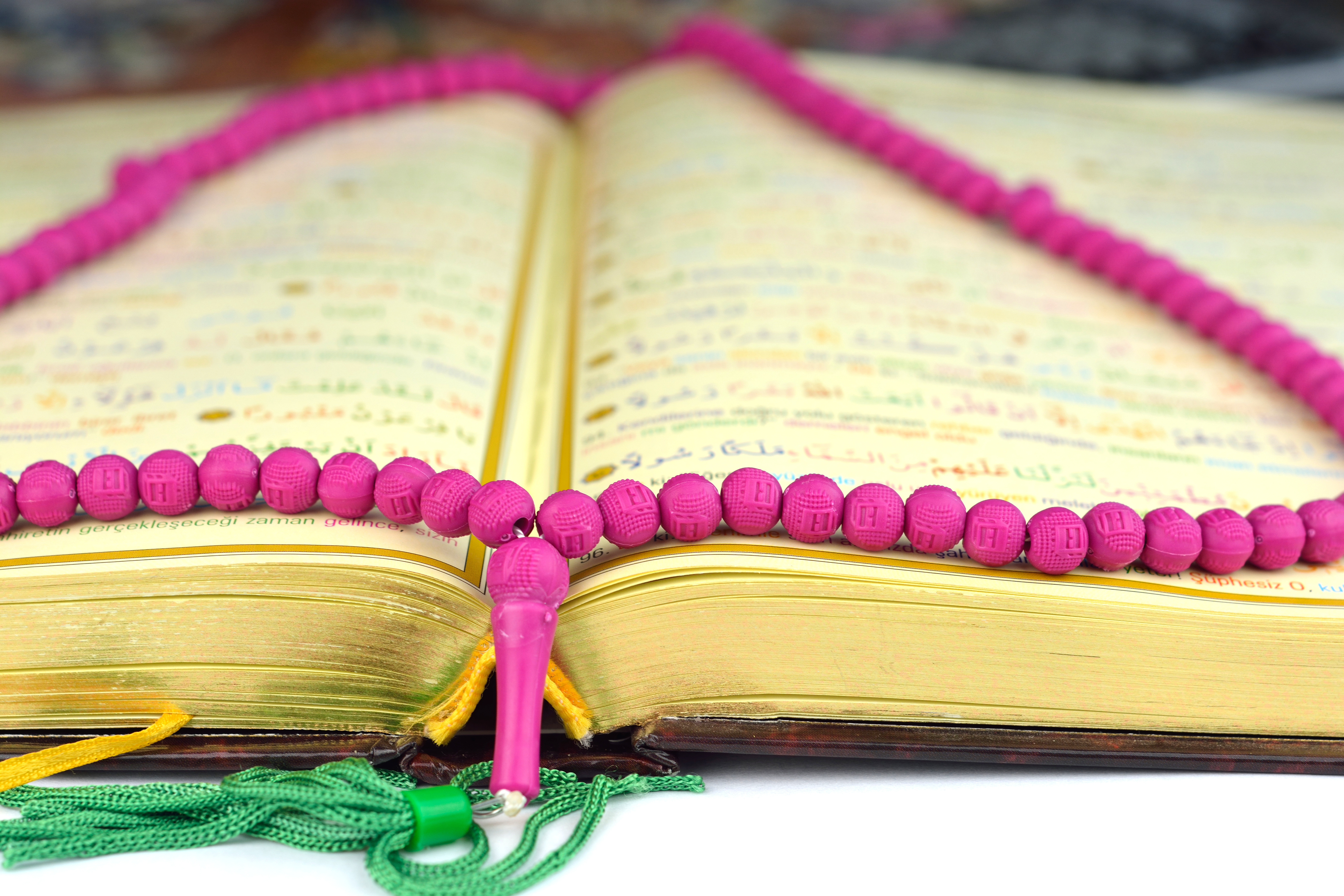 Holy Koran with a rosary praying beads - Religion & Symbols ...